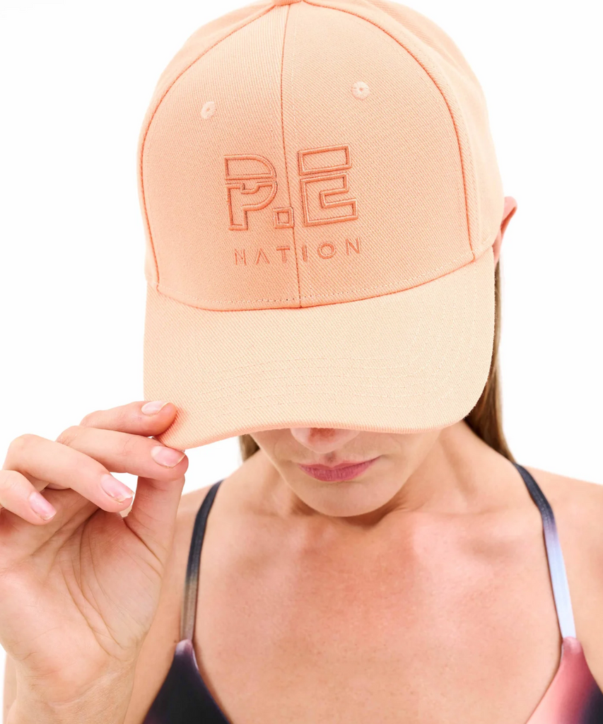 Official P.E Nation Definition Cap in Cantaloupe at ShoeGrab